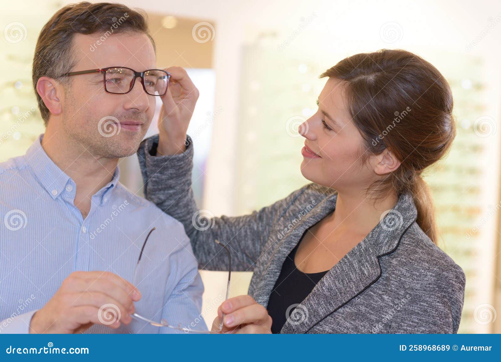Man fitting eyewear stock image. Image of assistant - 258968689