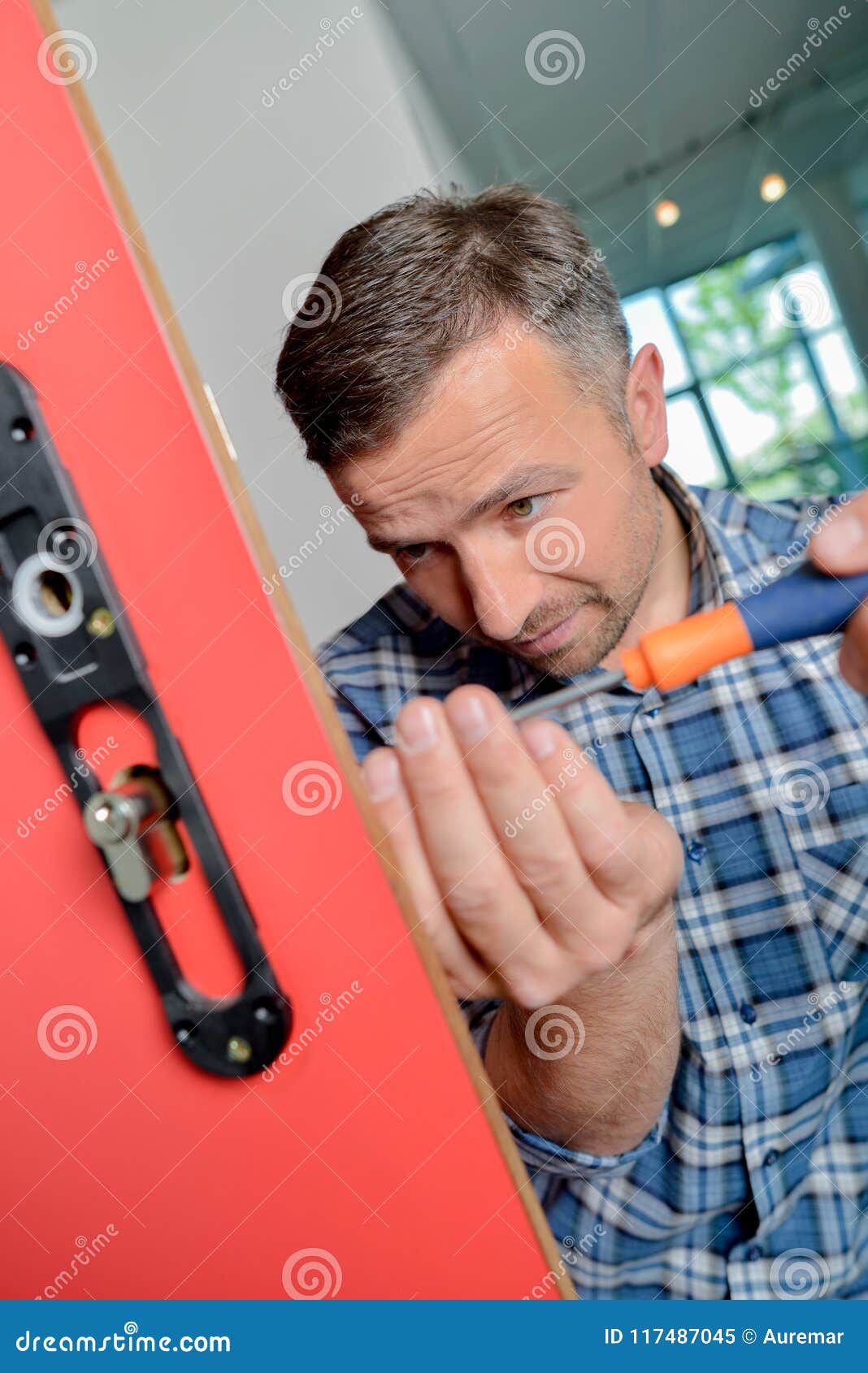 Man Fitting New Lock To Door Stock Image - Image of screwdriver, male ...