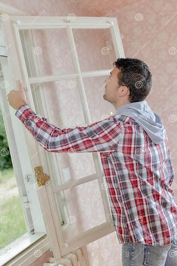 Man fitting new window stock image. Image of work, careful - 103747875