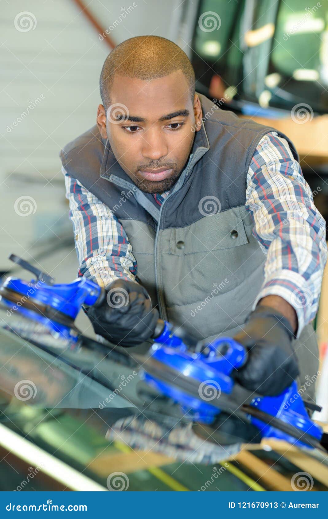 Man fitting new windshield stock image. Image of diversity - 121670913