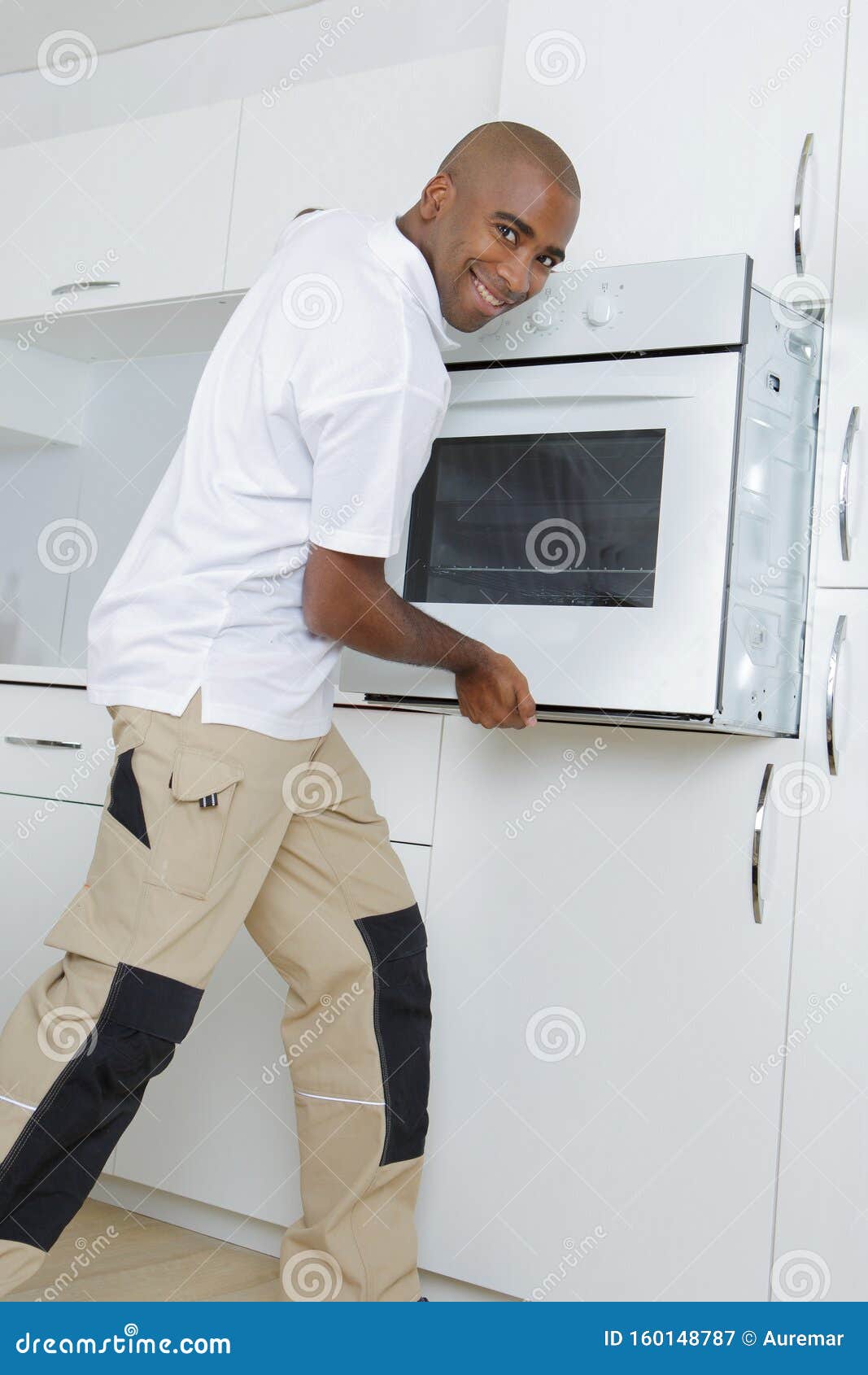 Man Fitting Oven into Kitchen Stock Image - Image of interior, fitted ...