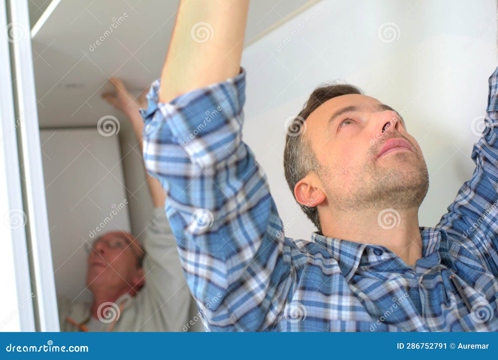 Man Fitting Plasterboard Ceiling Stock Image - Image of carpenter ...