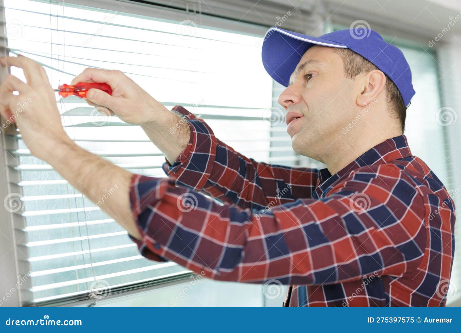 Man fitting window blind stock image. Image of screwdriver - 275397575