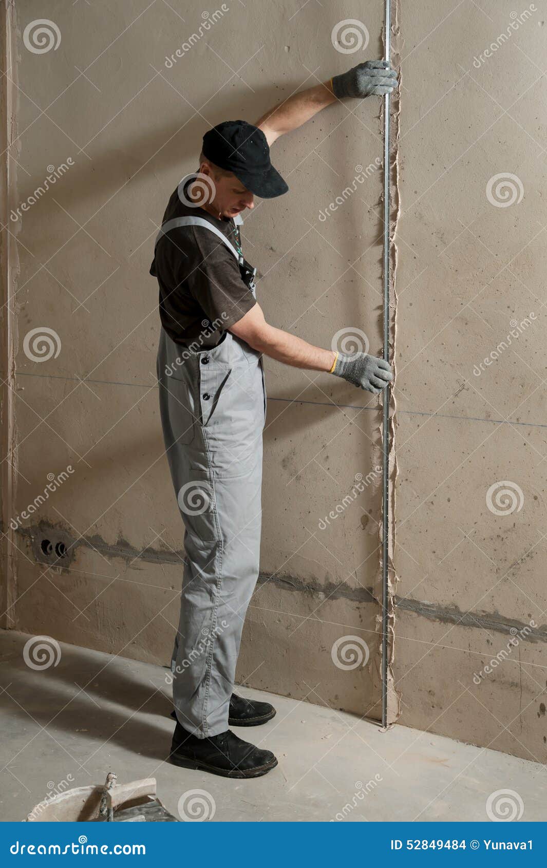 Man Fixes a Guide To Align the Walls with Stucco Stock Photo - Image of ...
