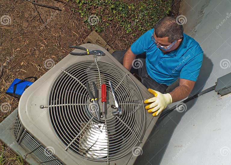 Man fixing air conditioner stock photo. Image of hands - 28623748