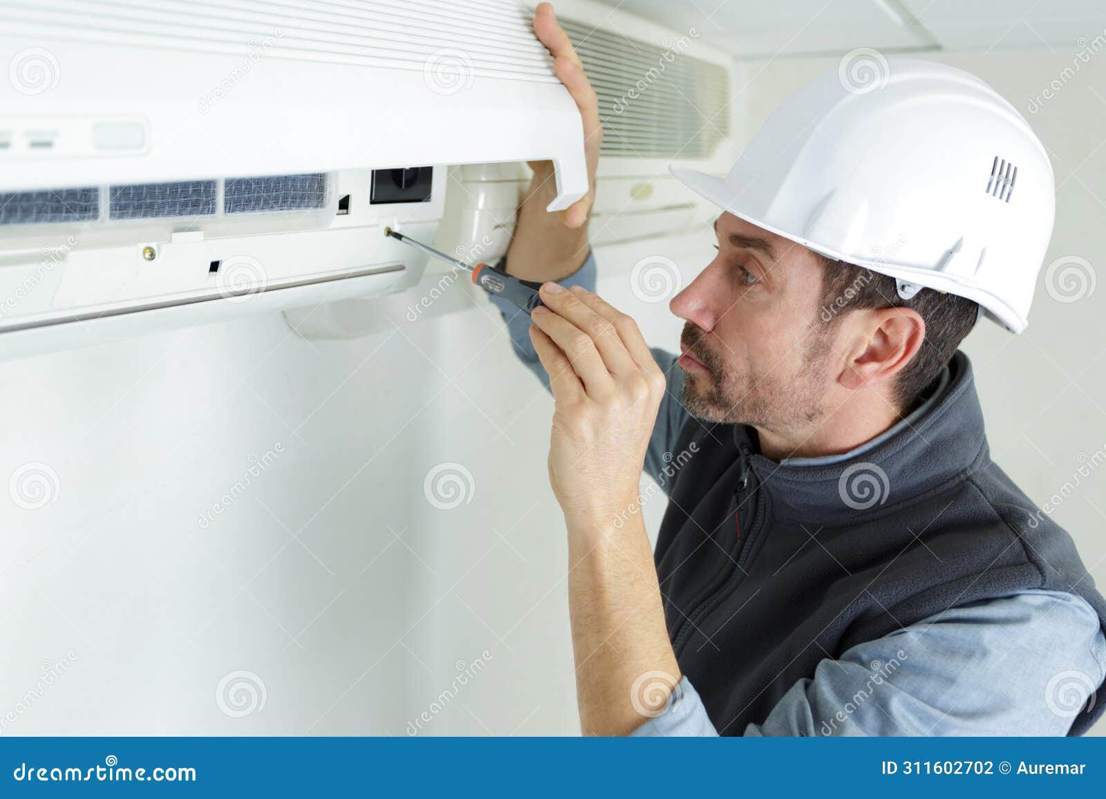 Man Fixing Air Conditioningsystem Stock Photo - Image of buildingsite ...