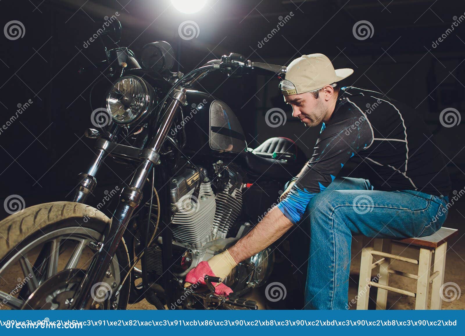 Man Fixing Bike. Confident Young Man Repairing Motorcycle Near His ...