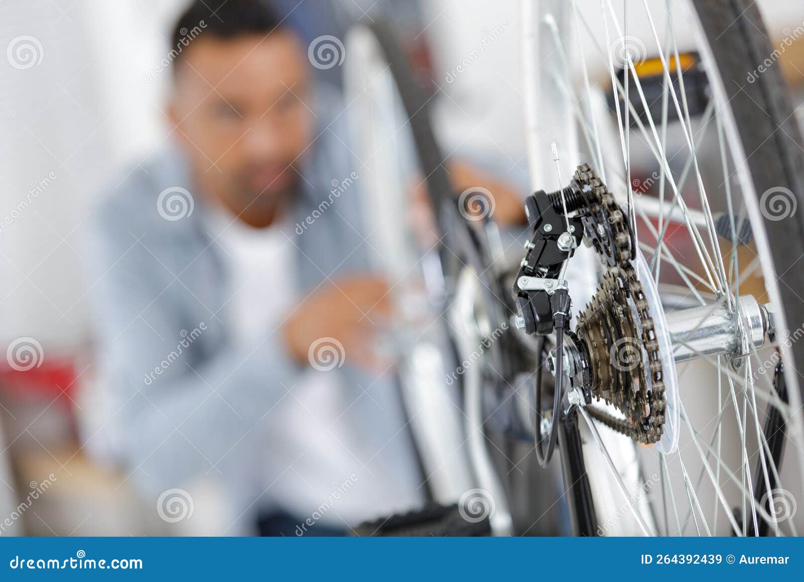 Man fixing bike inside stock image. Image of hammer - 264392439
