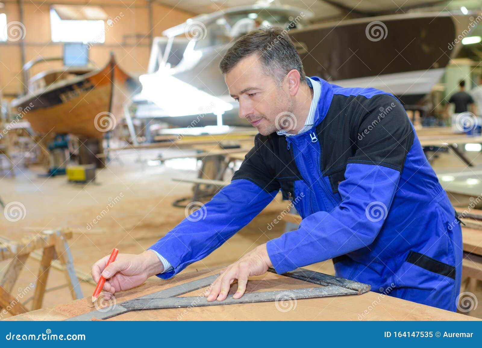 Man fixing boat stock image. Image of wood, measurment - 164147535