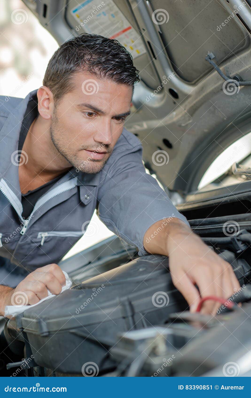 Man fixing car engine stock image. Image of people, check - 83390851