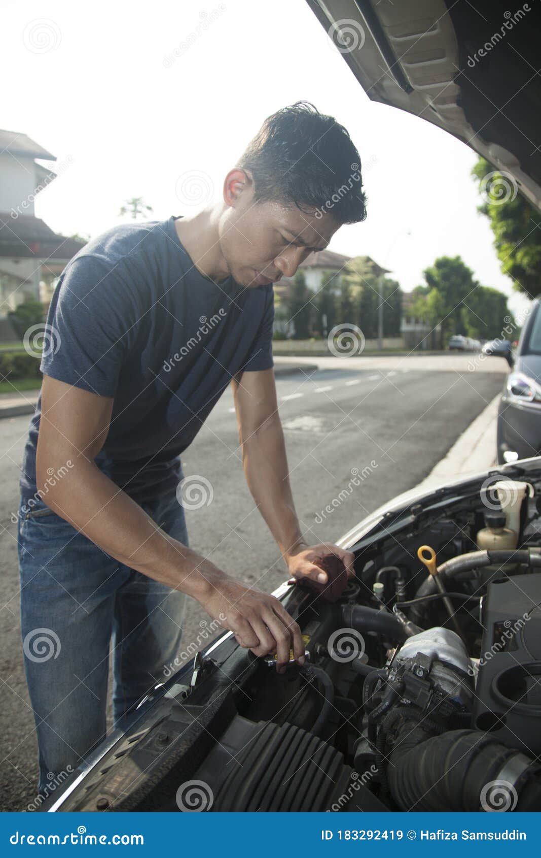 Man fixing a car stock image. Image of inspecting, traveling - 183292419