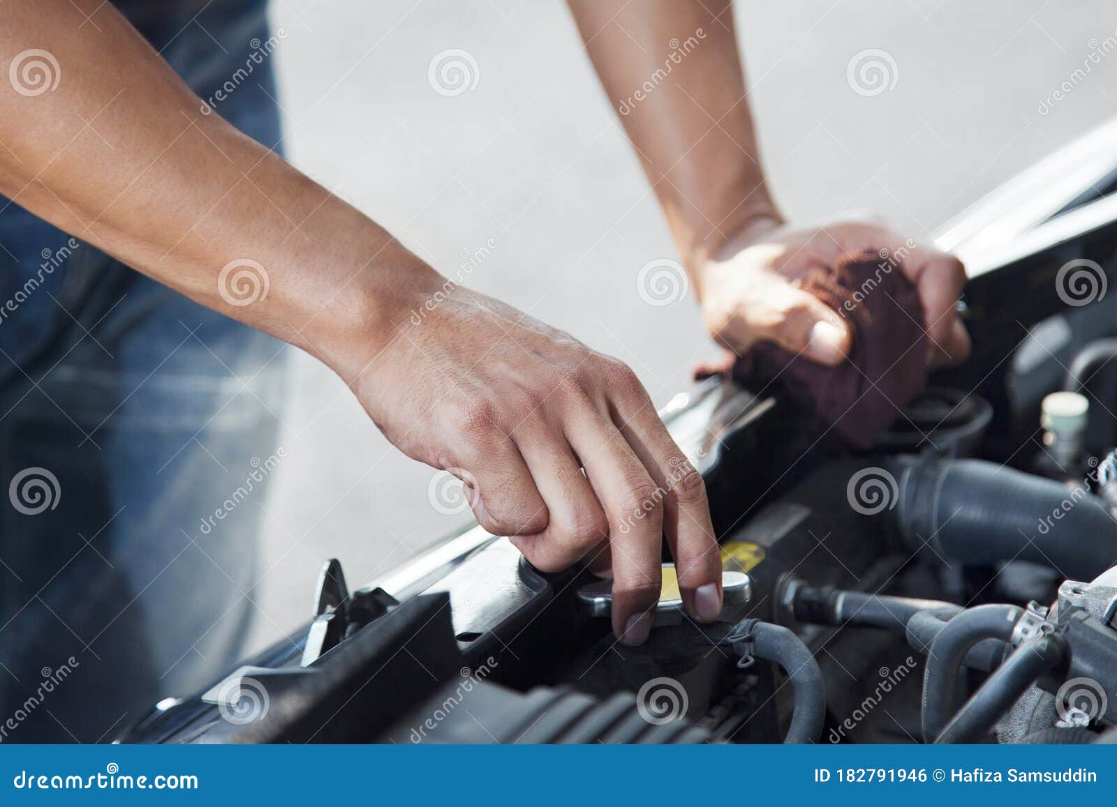 Man fixing a car stock photo. Image of closeup, examining - 182791946