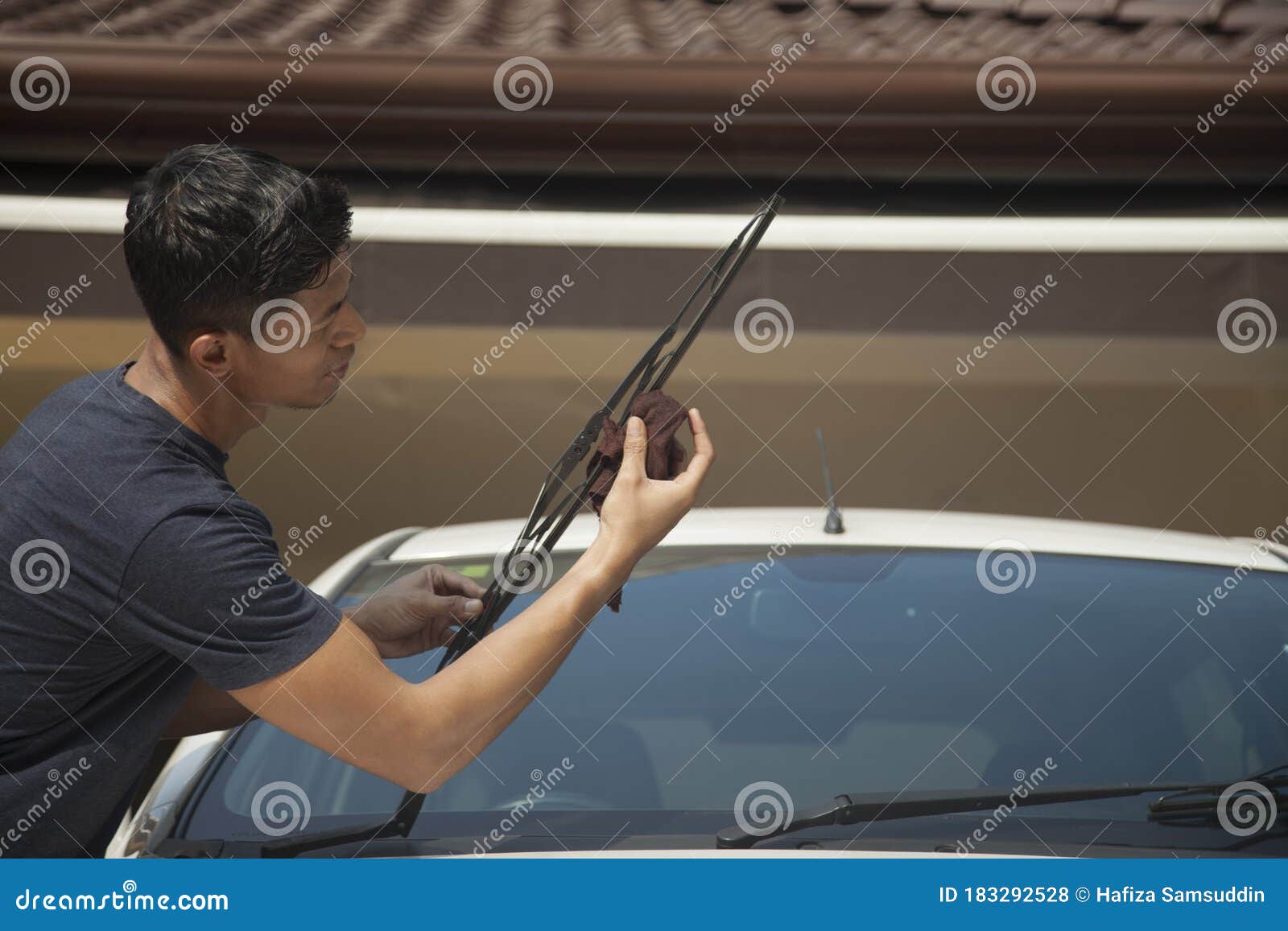 Man fixing a car stock photo. Image of examining, mechanic - 183292528