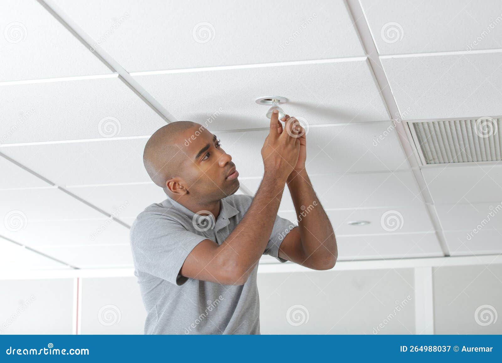 Man fixing ceiling stock image. Image of maintenance - 264988037