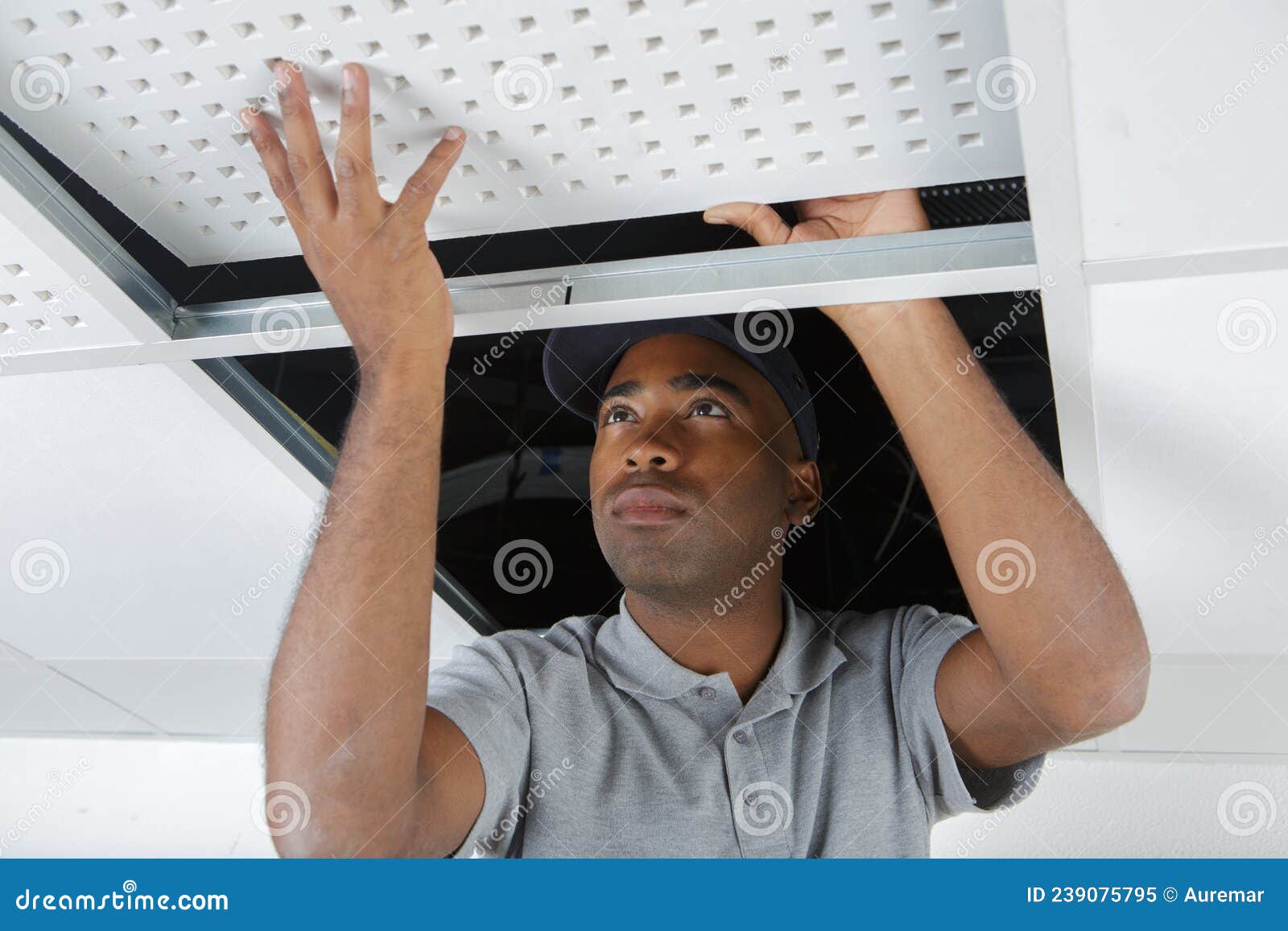 Man fixing ceiling stock image. Image of electrician - 239075795