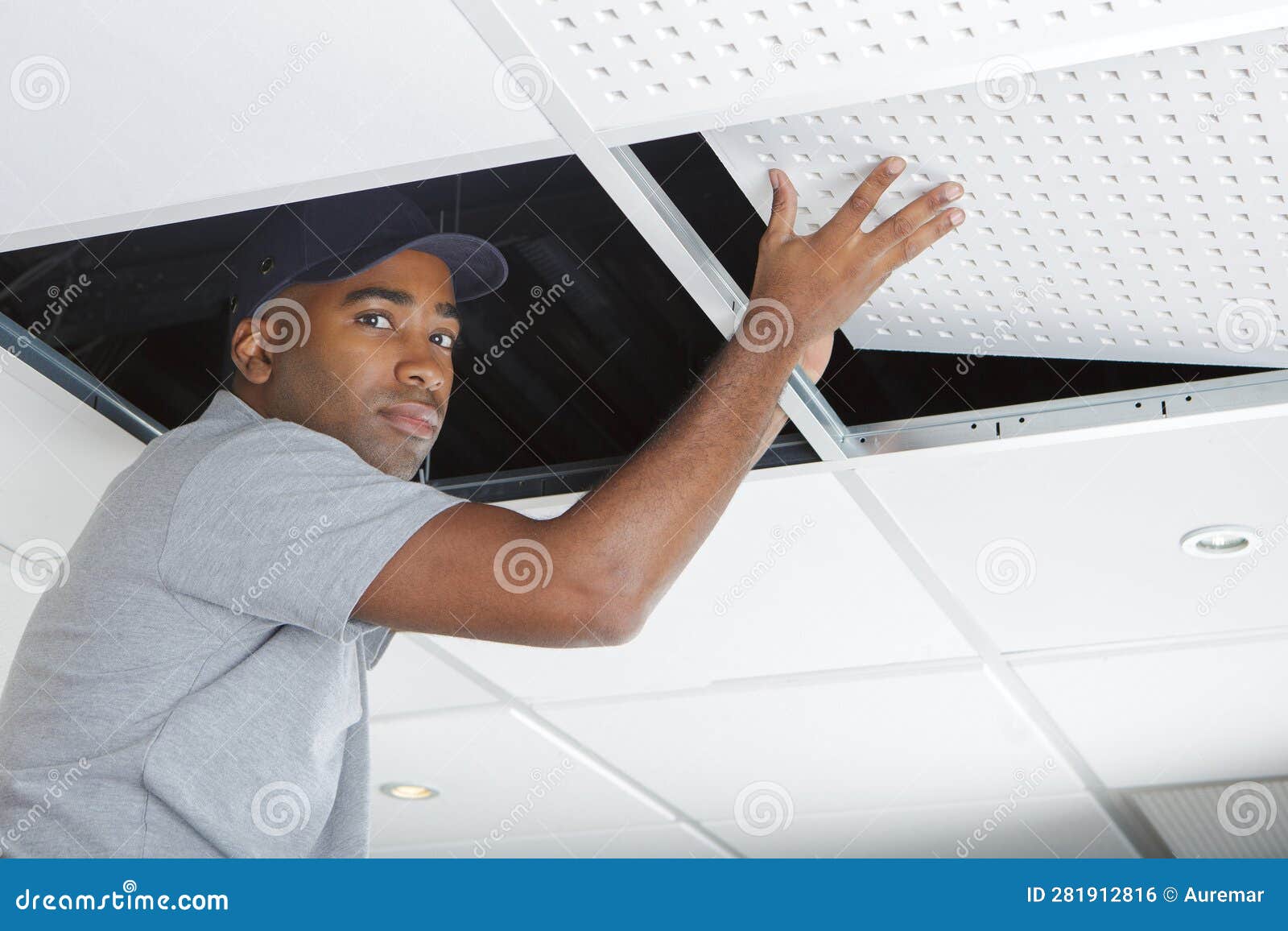 Man fixing ceiling stock photo. Image of office, repari - 281912816
