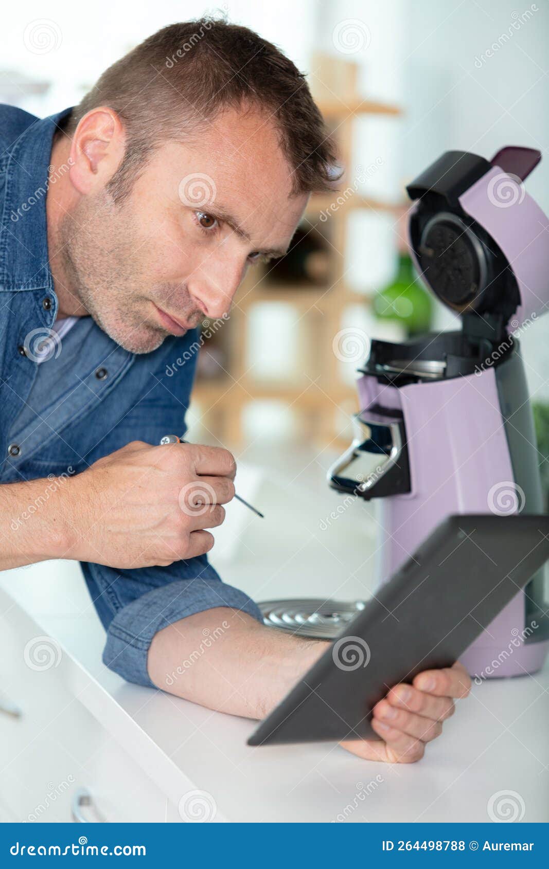 Man fixing coffee machine stock photo. Image of hardware - 264498788
