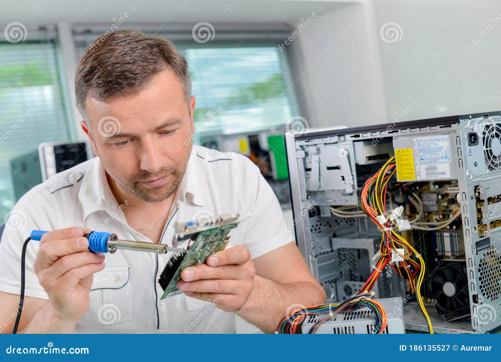 Man fixing computer stock image. Image of technical - 186135527