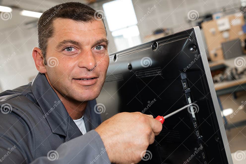 Man fixing computer screen stock image. Image of tight - 310487589