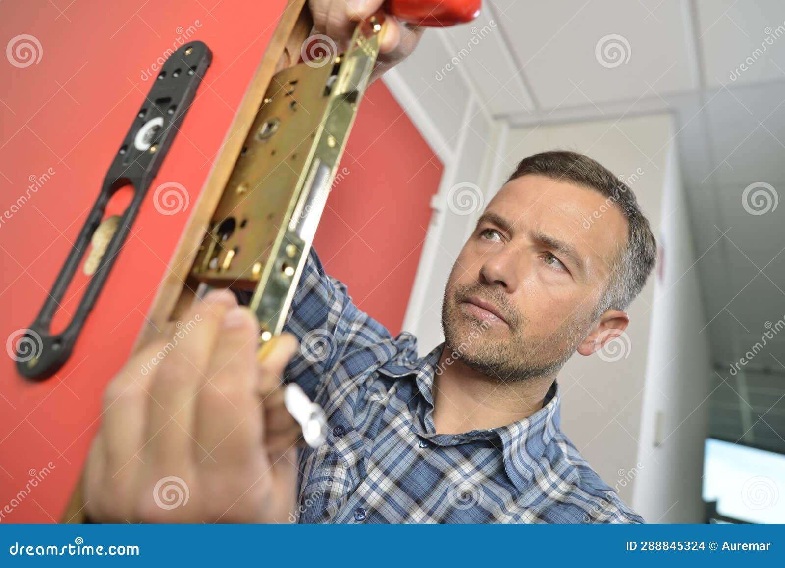 Man fixing door stock photo. Image of tool, vocational - 288845324