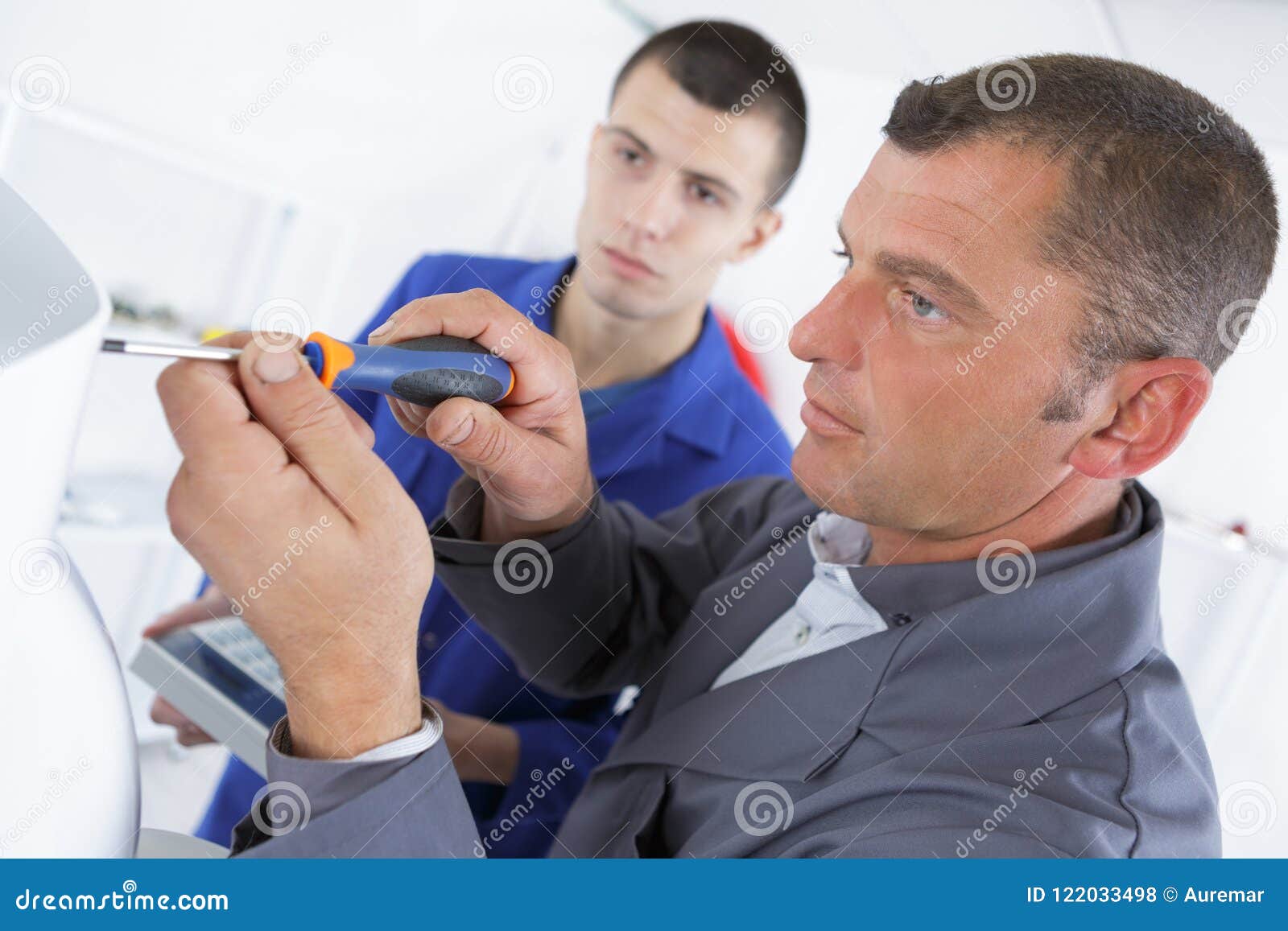 Man Fixing Electronic Circuits in Service Center Stock Photo - Image of ...