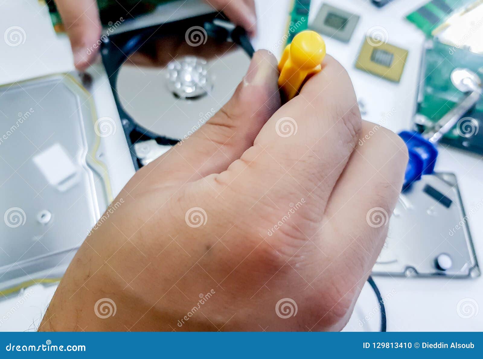 Man fixing electronics stock photo. Image of equipments - 129813410