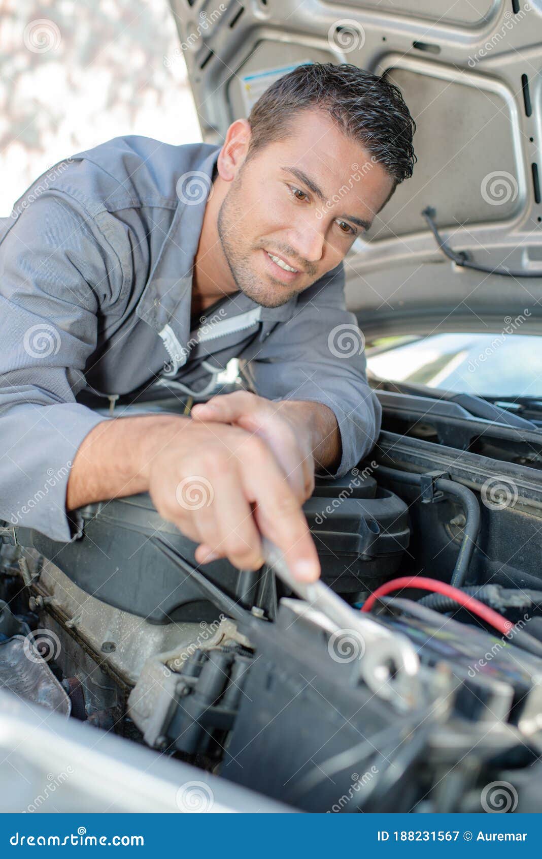 Man fixing engine stock image. Image of employment, repairman - 188231567