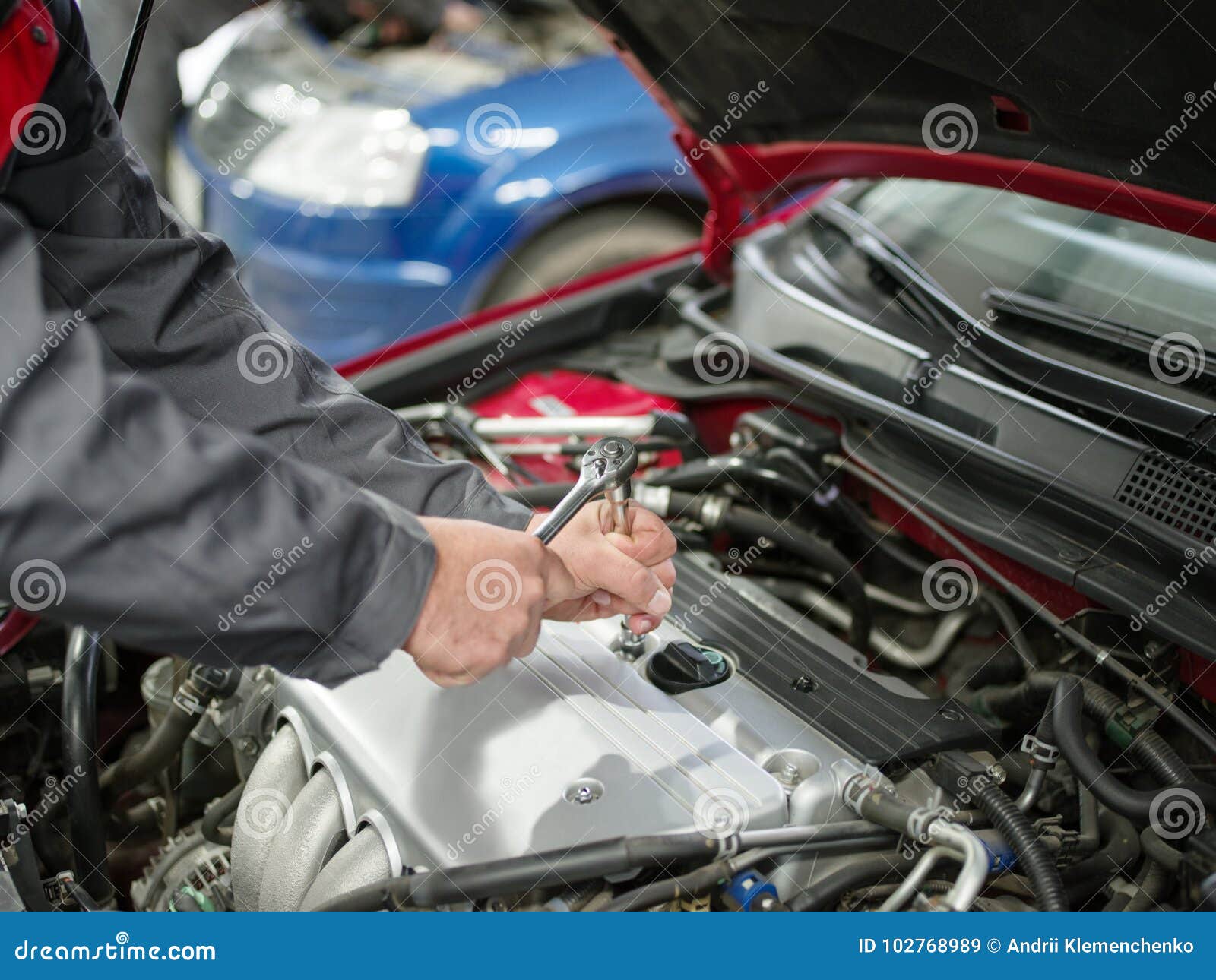 The Man is Fixing the Engine. Stock Image - Image of brunette, disks ...