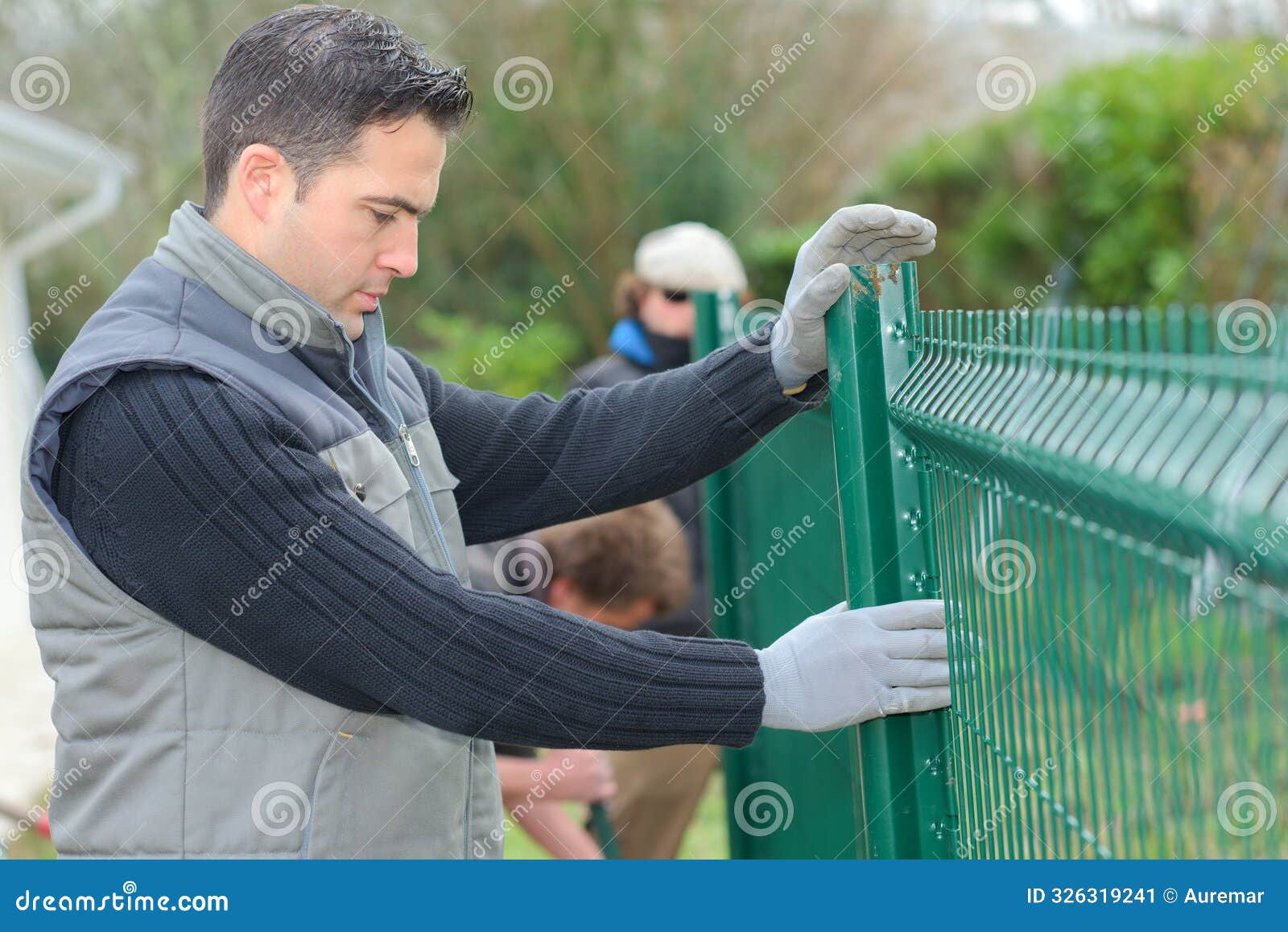 Man fixing fencing stock image. Image of steel, frame - 326319241
