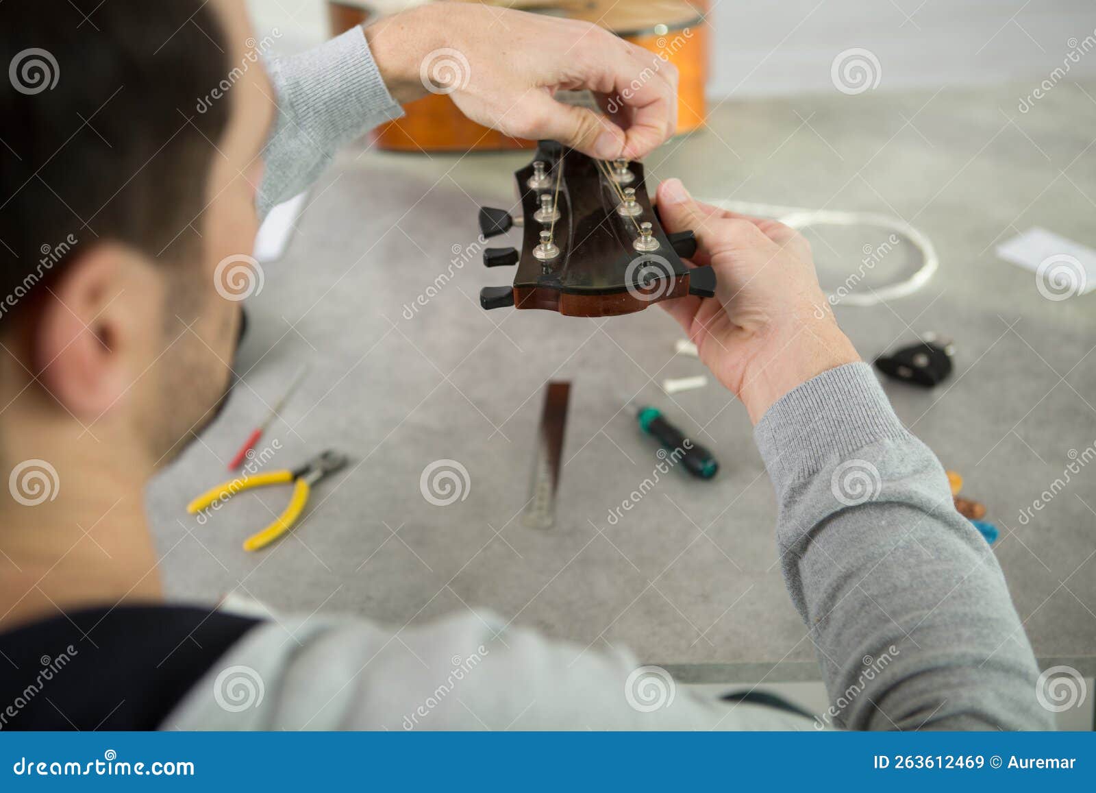 Man fixing guitar stock image. Image of oneperson, lutemaker - 263612469