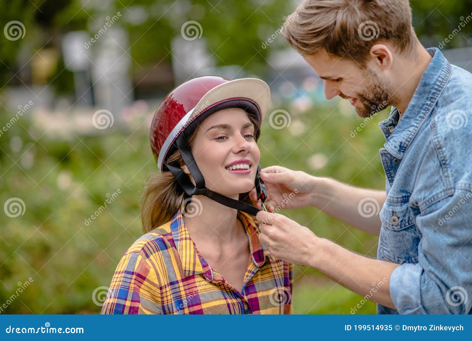 Man Fixing a Helmet on Womans Head Stock Image - Image of relations ...