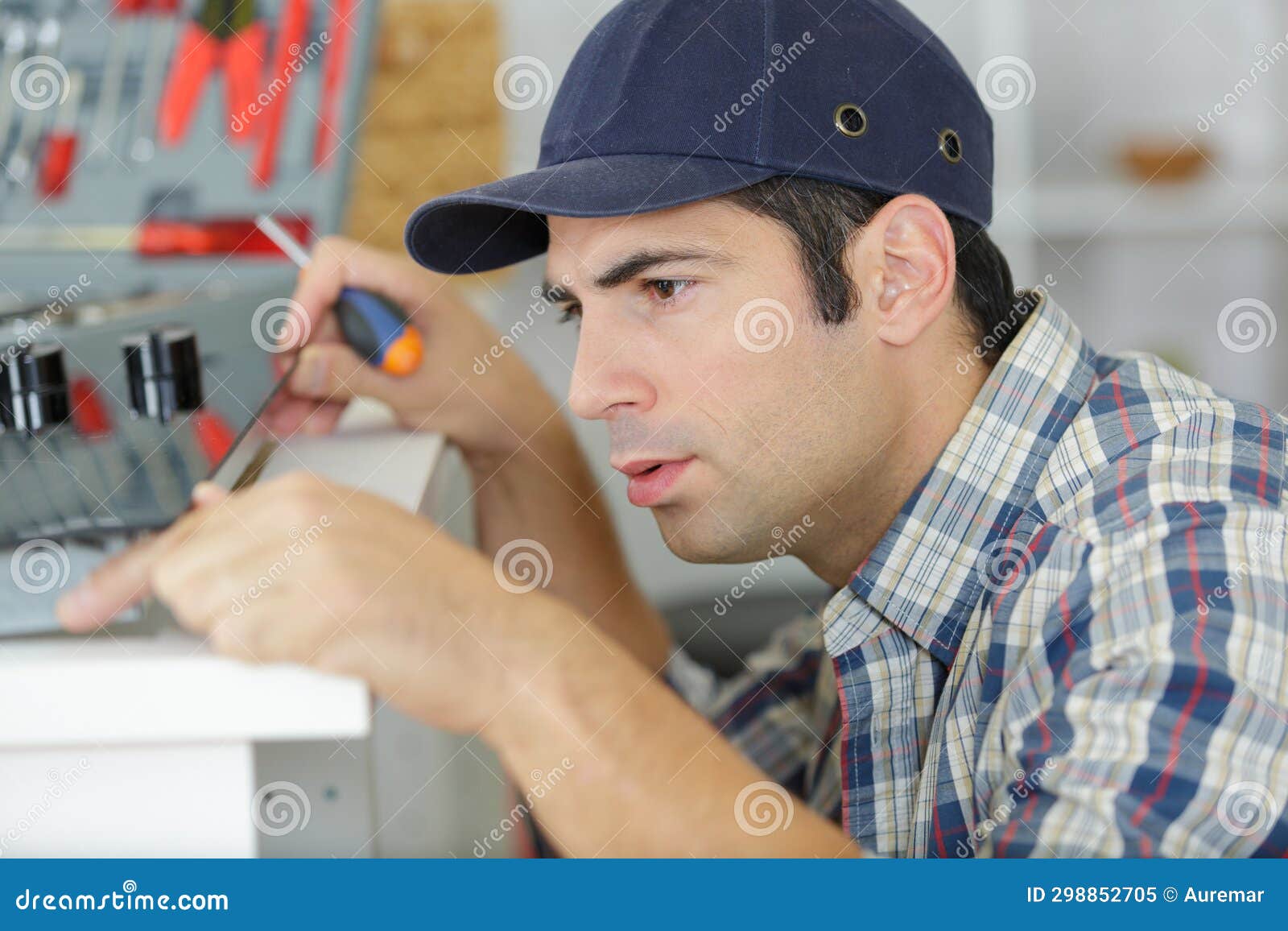 Man fixing kitchen board stock image. Image of male - 298852705