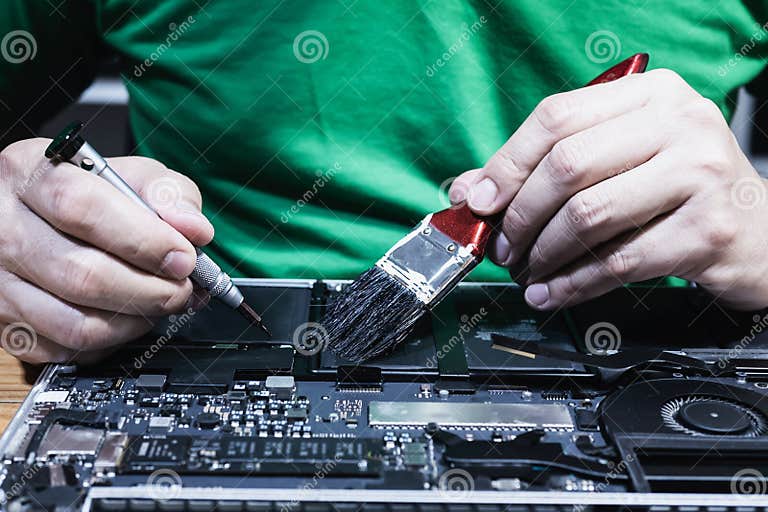 Man fixing laptop computer stock photo. Image of component - 232085850