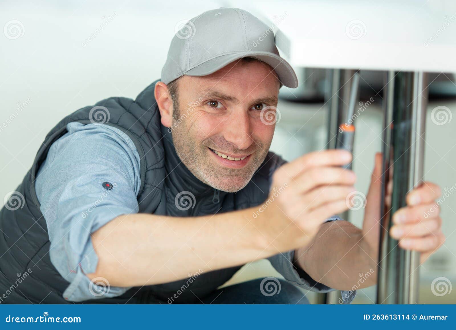 Man fixing leg table stock photo. Image of house, mature - 263613114