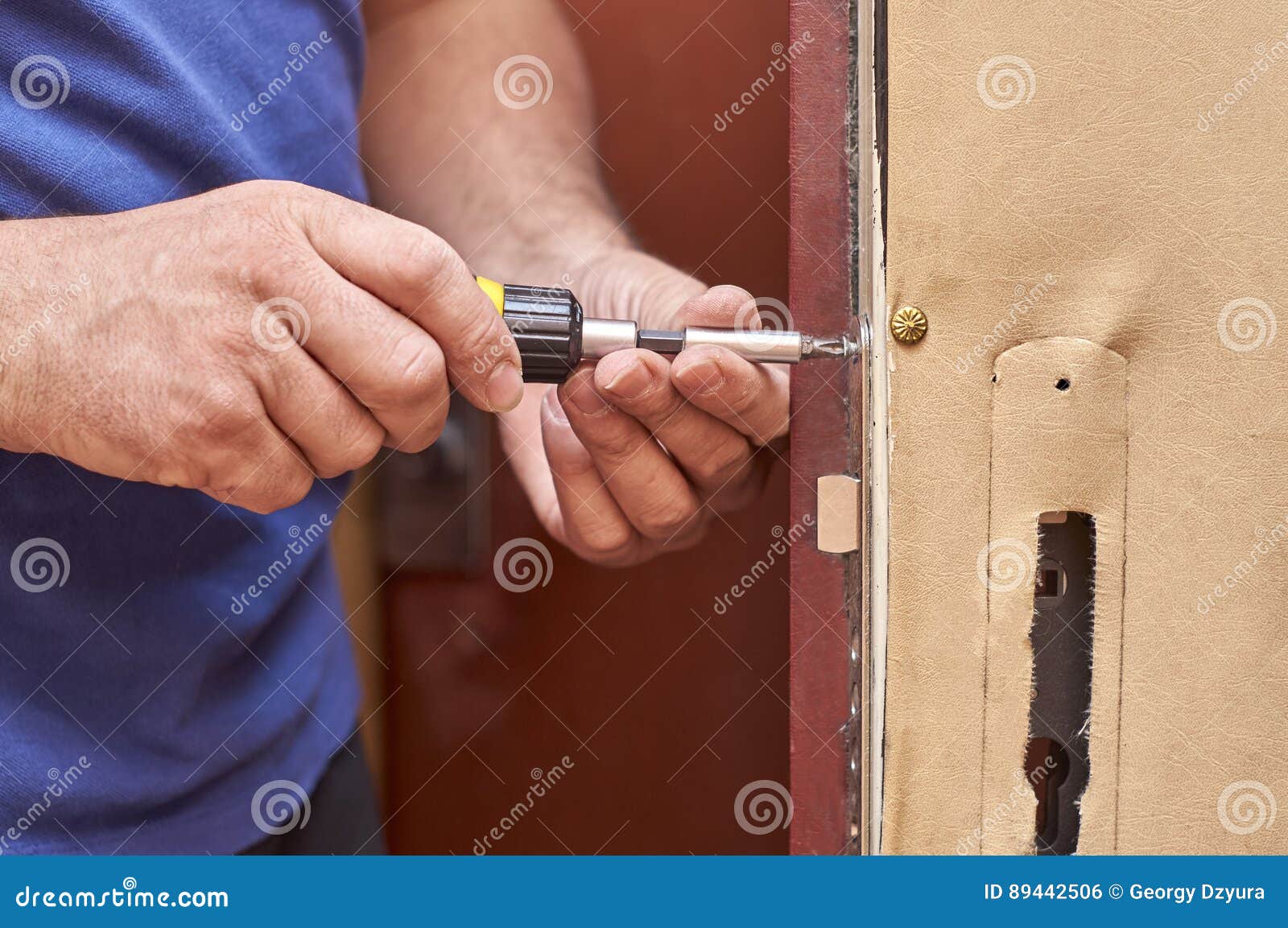 Man Fixing a Lock in Old Door Stock Photo - Image of handle, contractor ...