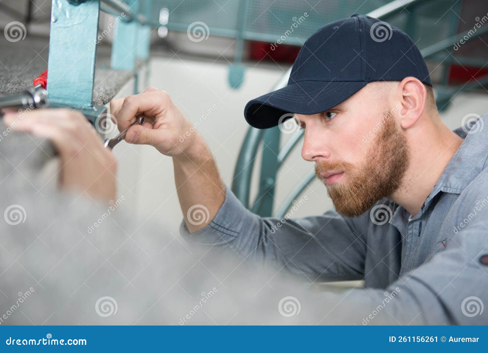 Man Fixing Machine in Factory Stock Image - Image of mechanician, metal ...