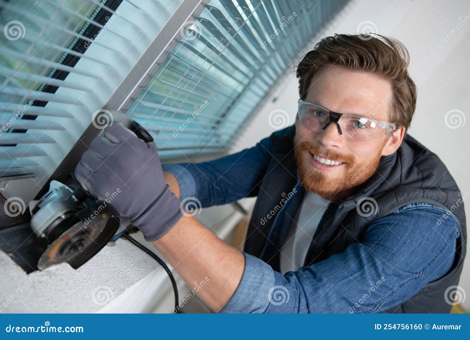 Man Fixing Metal Frame Using Angle Grinder on Windows Stock Photo ...