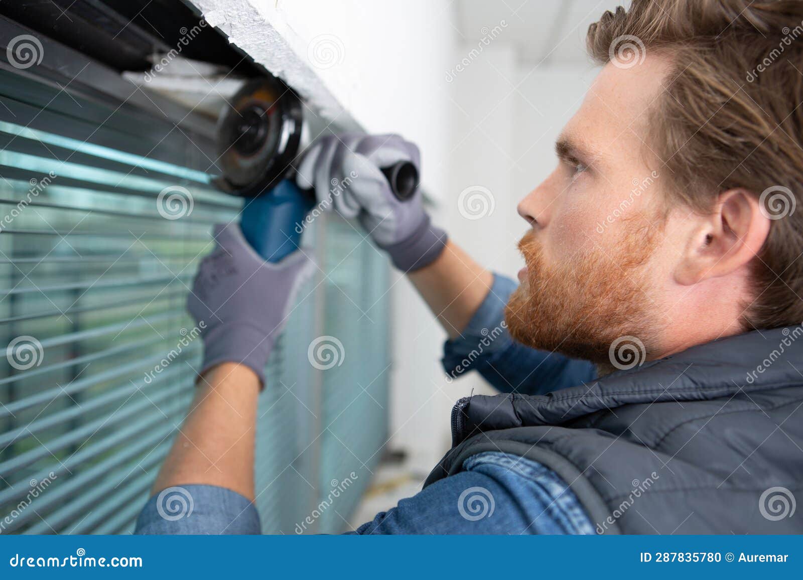 Man Fixing Metal Frame Using Angle Grinder on Windows Stock Photo ...