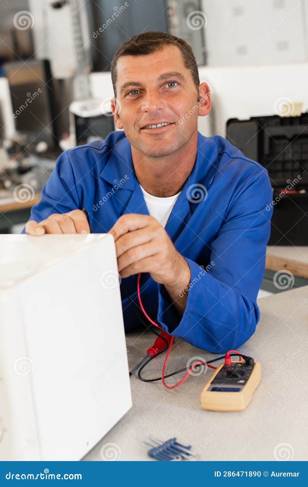 Man fixing microwave oven stock photo. Image of electricity - 286471890