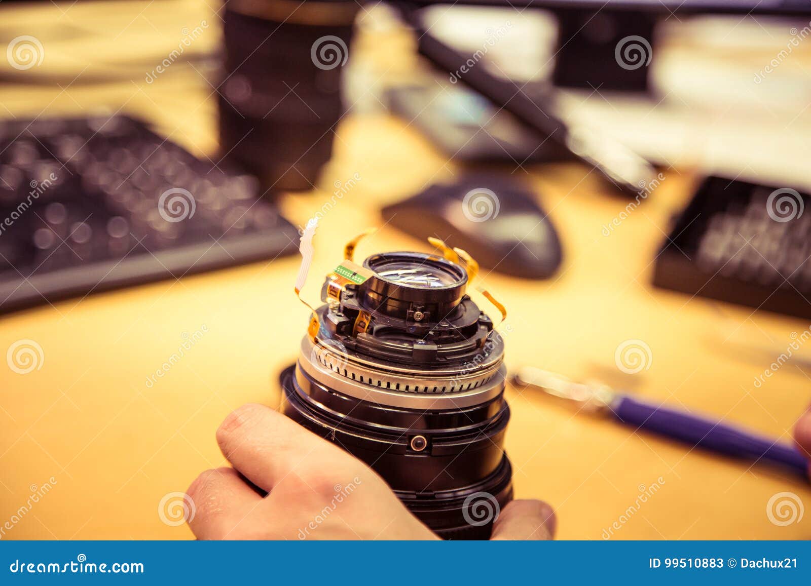 A Man Fixing Photo Camera Lens on an Office Table Stock Image - Image ...