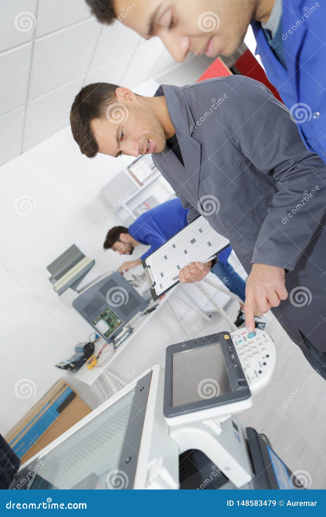 Man fixing photo copier stock image. Image of open, office - 148583479