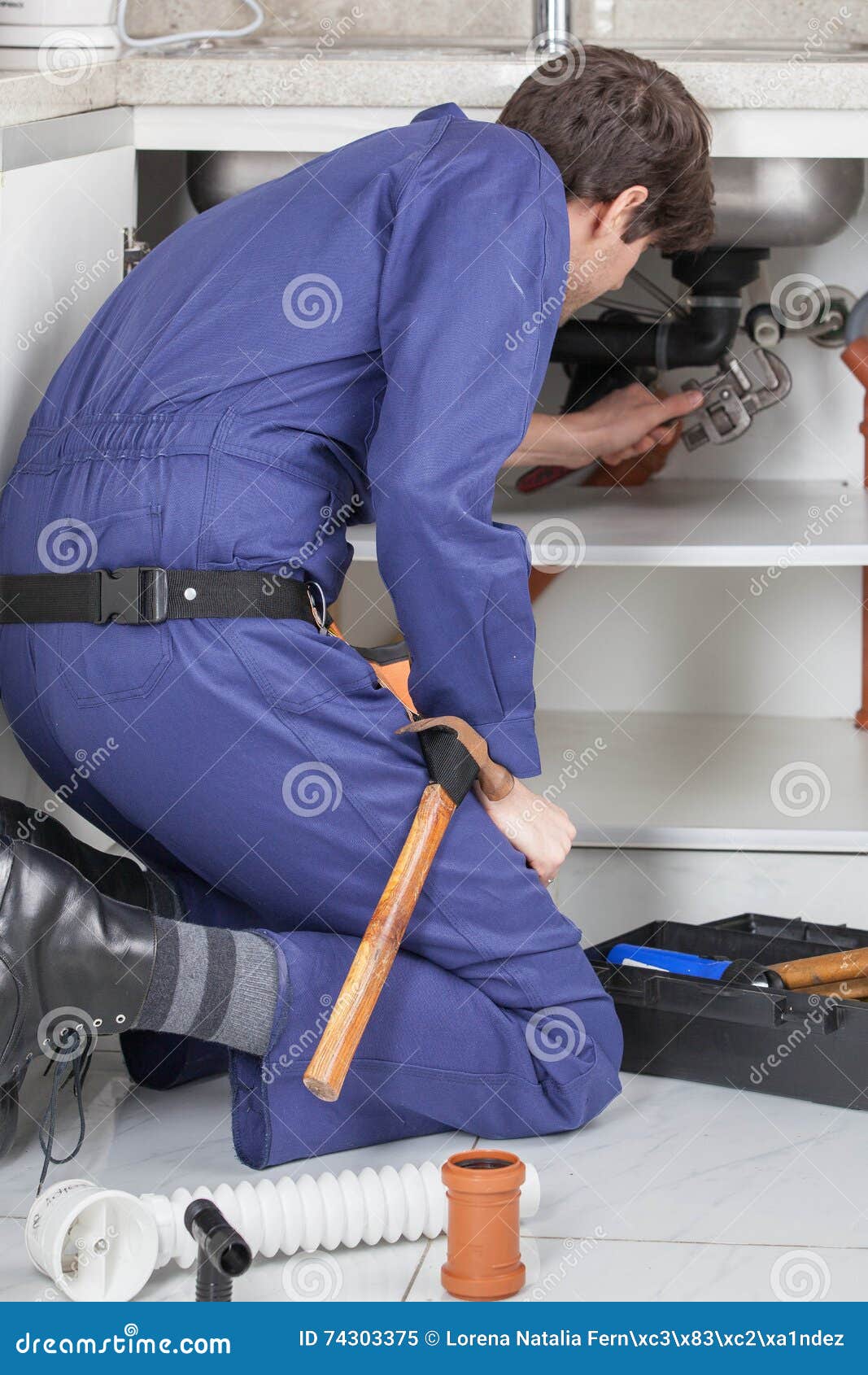 Man fixing pipe stock image. Image of plumbing, contractor - 74303375