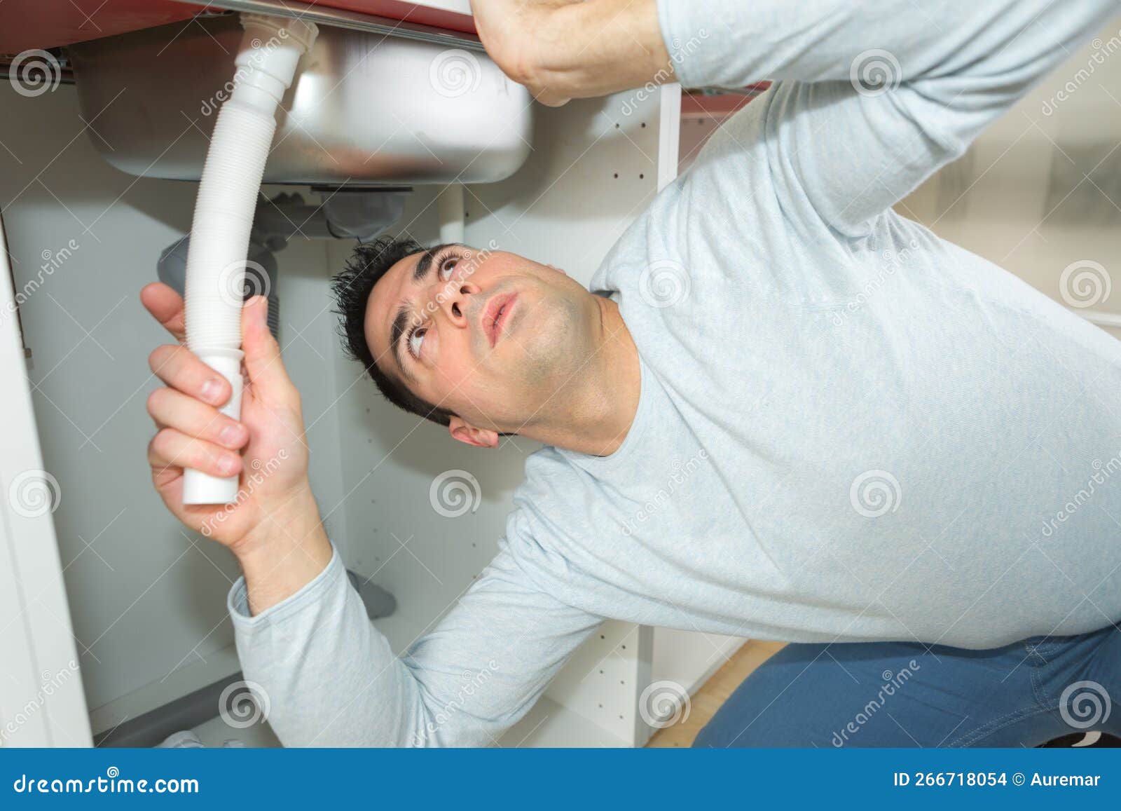 Man Fixing Pipe with Wrench Stock Photo - Image of rotate, build: 266718054