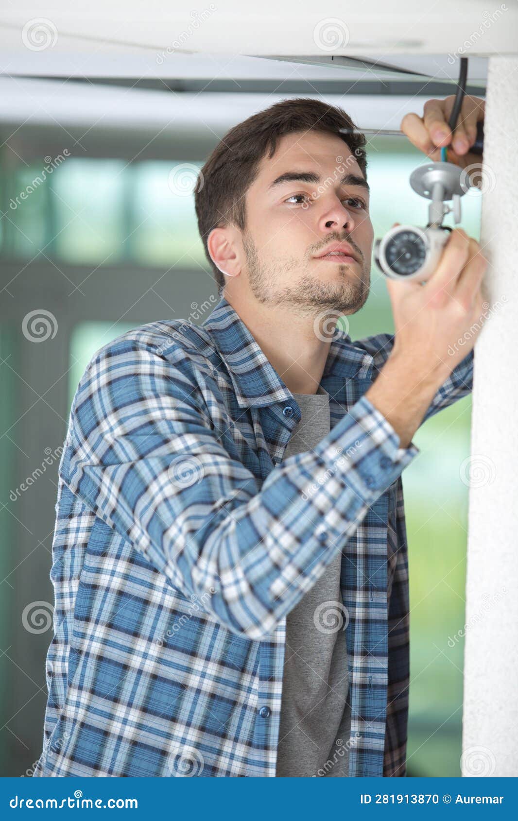 Man Fixing Security Camera To Ceiling Stock Photo - Image of record ...