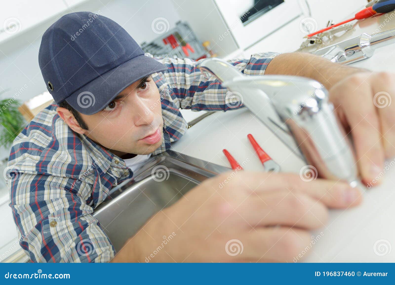 Man Fixing Sink Pipe in Kitchen Stock Photo - Image of hoses, domicile ...