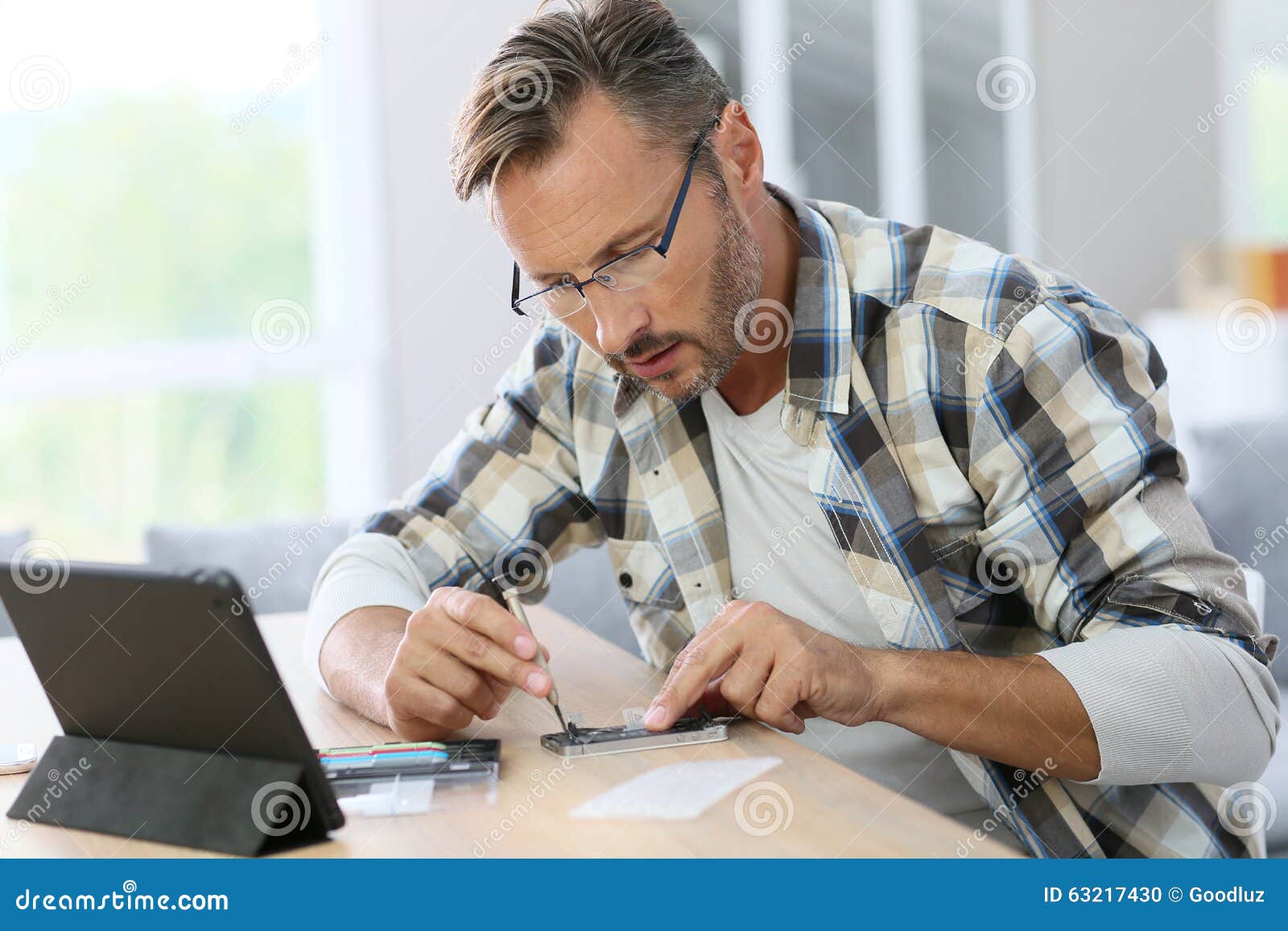Man fixing smartphone stock photo. Image of digital, fixing - 63217430