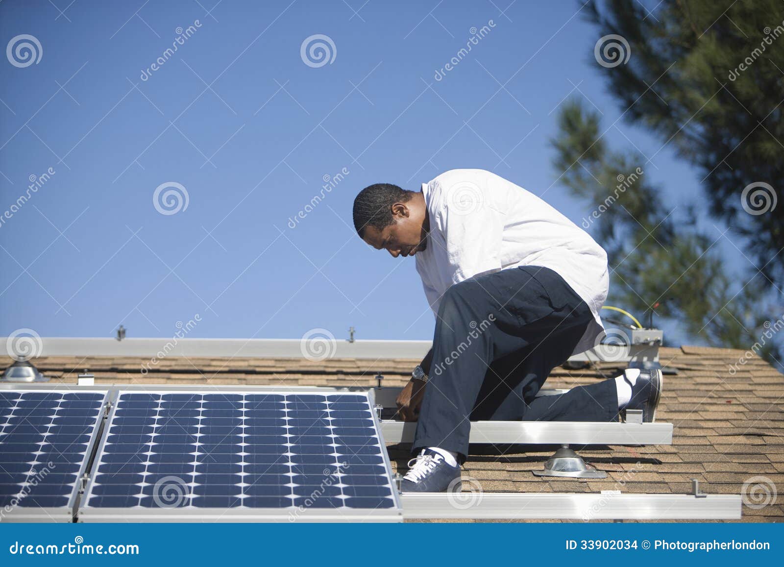 Man Fixing Solar Panel on Rooftop Stock Photo - Image of palm ...