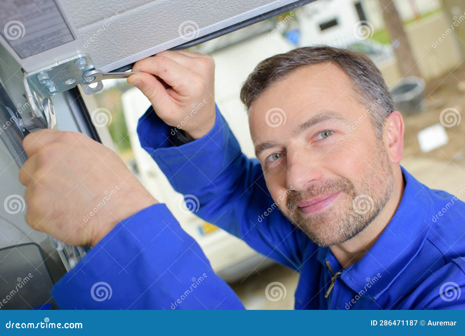 Man fixing something stock image. Image of protective - 286471187