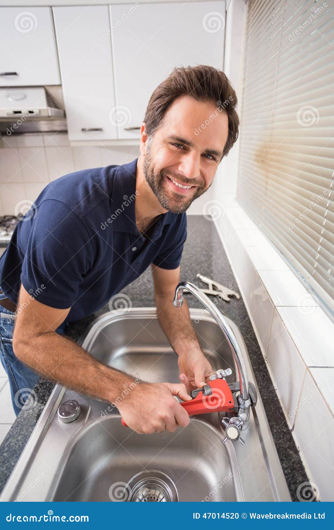 Man fixing tap with tool stock photo. Image of mechanic - 47014520