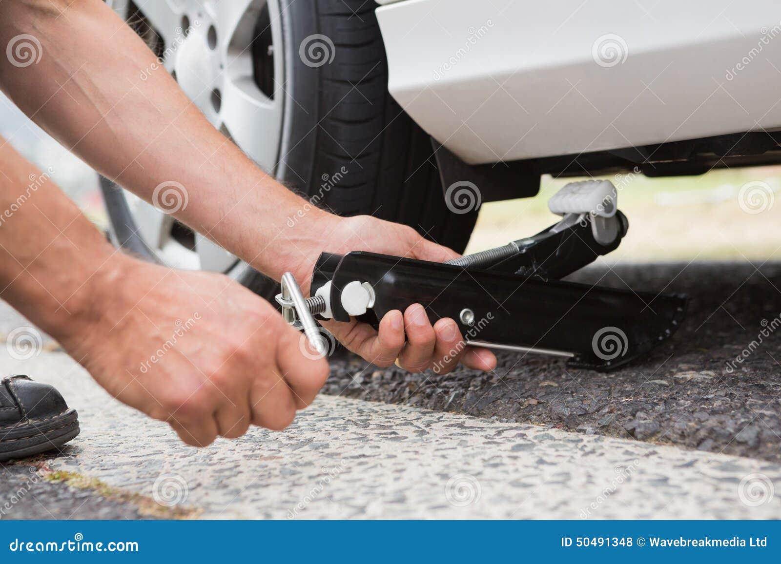 Man fixing tire stock photo. Image of automobile, lifestyle - 50491348
